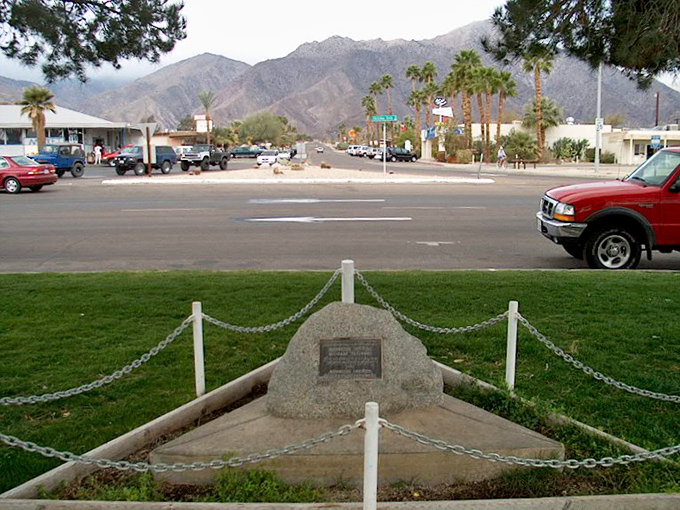 Main Street vibes with mountain majesty as a backdrop. This isn't a movie set &ndash; it's everyday life in Desert Hot Springs.