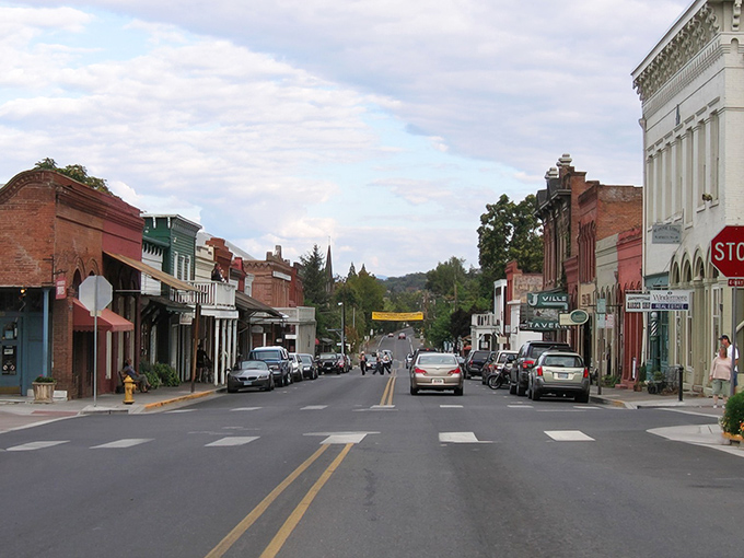 Main Street unfolds like a movie set where actual people live their lives. The kind of place where "rush hour" means three people at the crosswalk.