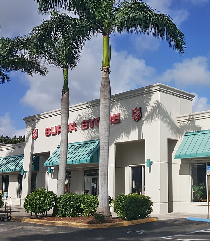 The architectural equivalent of a no-nonsense aunt who always has exactly what you need. Those teal awnings practically whisper "bargains inside."
