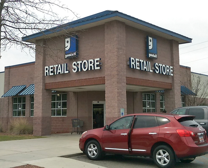 Blue awnings and brick fa&ccedil;ade give this thrift paradise a surprisingly upscale look. The red car out front? Someone smart enough to know where the deals live.