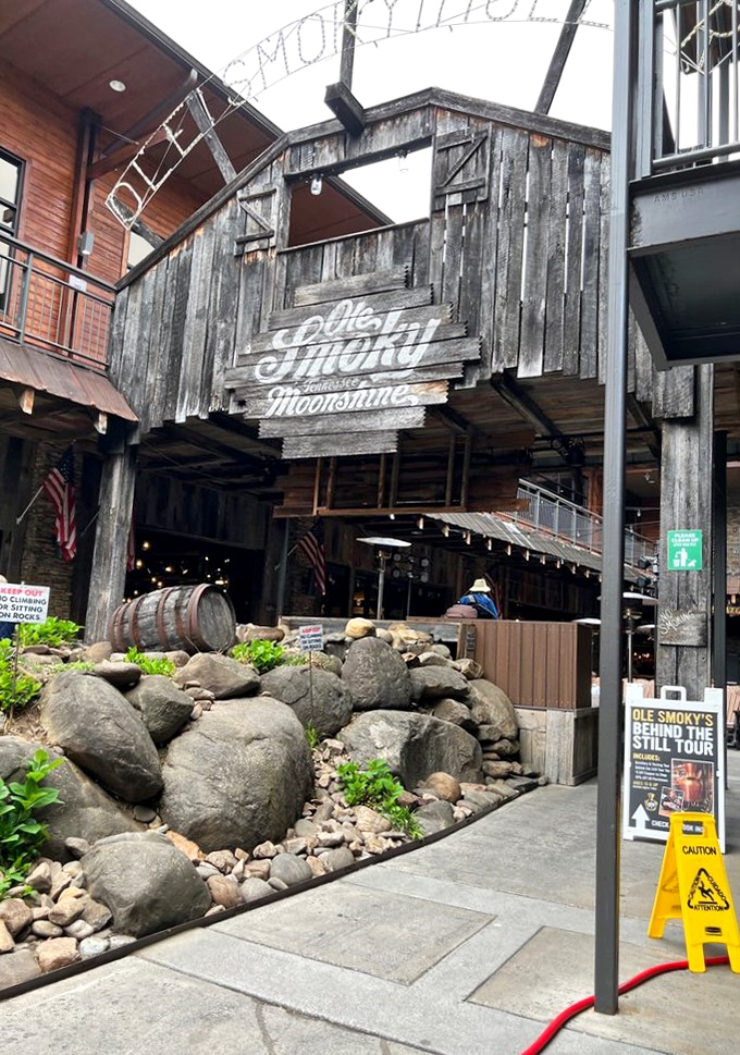 Mountain craftsmanship meets modern tourism at the entrance to Ole Smoky. That weathered wood exterior isn't just for show—it's authentic Appalachian style brought downtown.