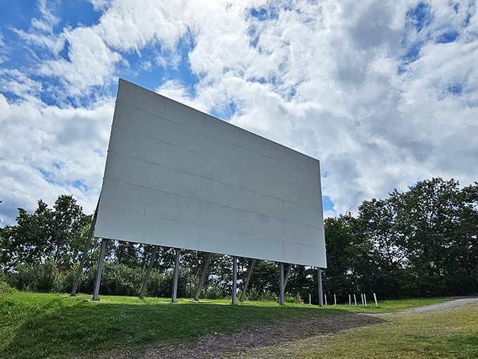 Standing sentinel against the Pennsylvania sky, this massive white screen has been collecting memories since 1949, a monument to simpler pleasures.