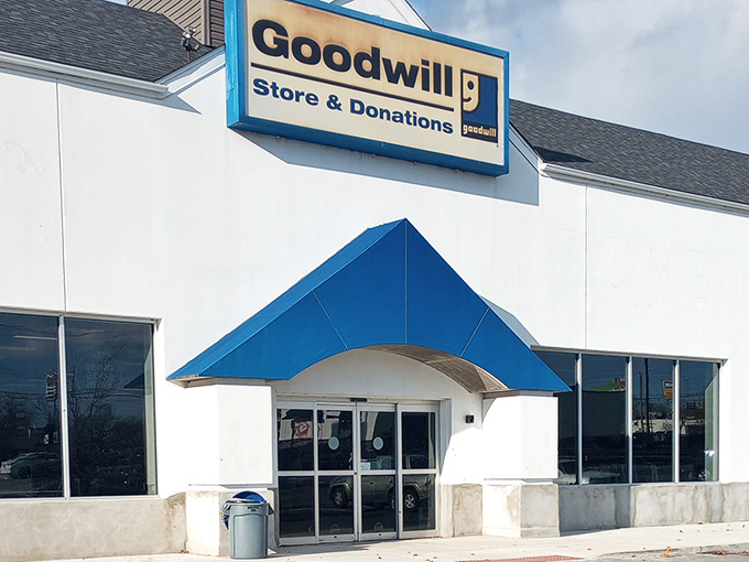 The blue awning beckons like a beacon for bargain hunters seeking retail therapy without the sticker shock.