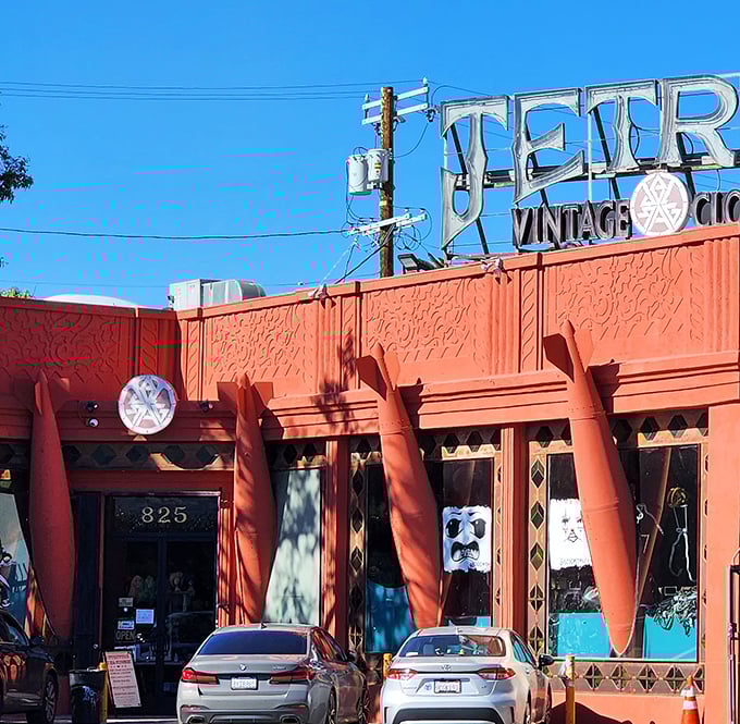 The coral-colored facade promises adventures in secondhand splendor just beyond those welcoming doors.