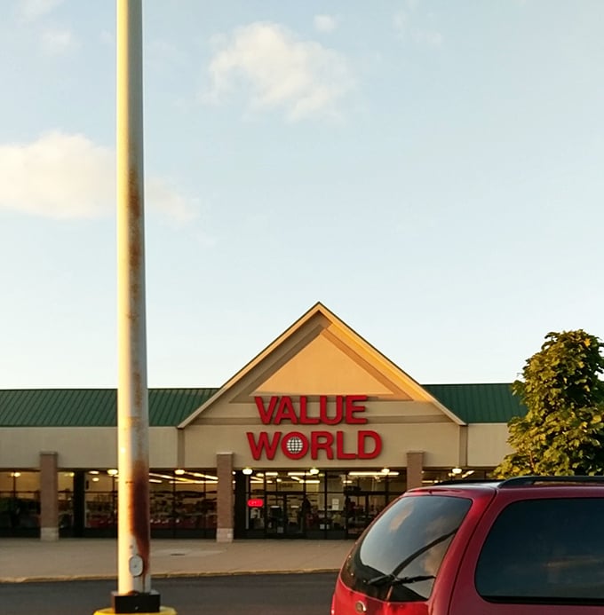 Bathed in golden hour light, Value World's distinctive red signage beckons to thrift enthusiasts like a lighthouse guiding ships to treasure-filled shores.