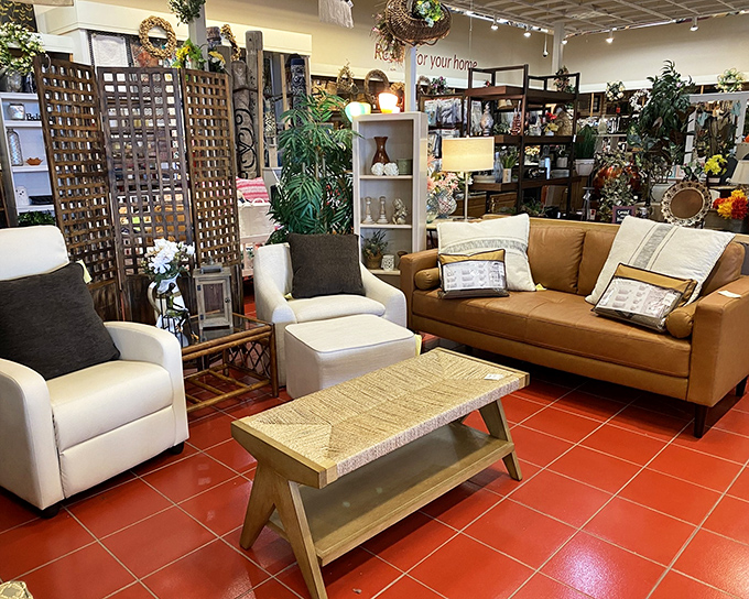 Mid-century meets modern comfort in this living room vignette. That caramel leather sofa is practically begging you to sit down with a good book.