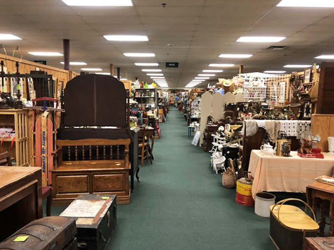 Endless aisles of possibility stretch before you like a green-carpeted time tunnel, each booth a portal to a different decade.
