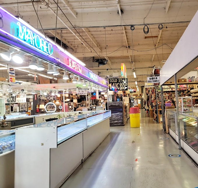 Neon signs and glass display cases stretch into infinity, promising jewelry treasures that would make Elizabeth Taylor nod in approval.
