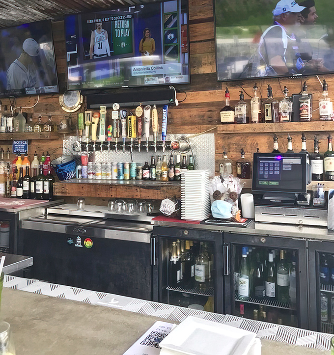 Behind the bar, an impressive array of spirits stands ready while sports play on overhead screens&mdash;the perfect backdrop for swapping fish tales.