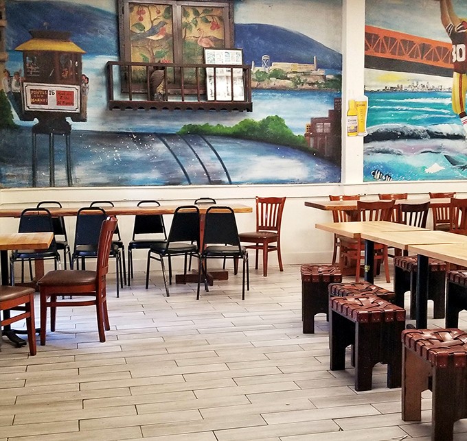 Colorful murals depicting San Francisco landmarks create a dining atmosphere that's both local and transportive.