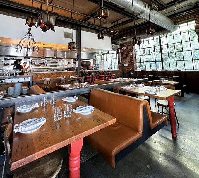 Where rustic meets refined: Bestia's interior transforms a former warehouse into a temple of Italian gastronomy, copper pots dangling like delicious promises.