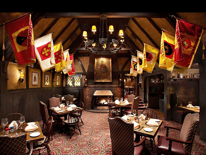 Step inside to a world where heraldic banners hang proudly, fireplaces crackle, and you half expect a knight to come clanking in for the early bird special.