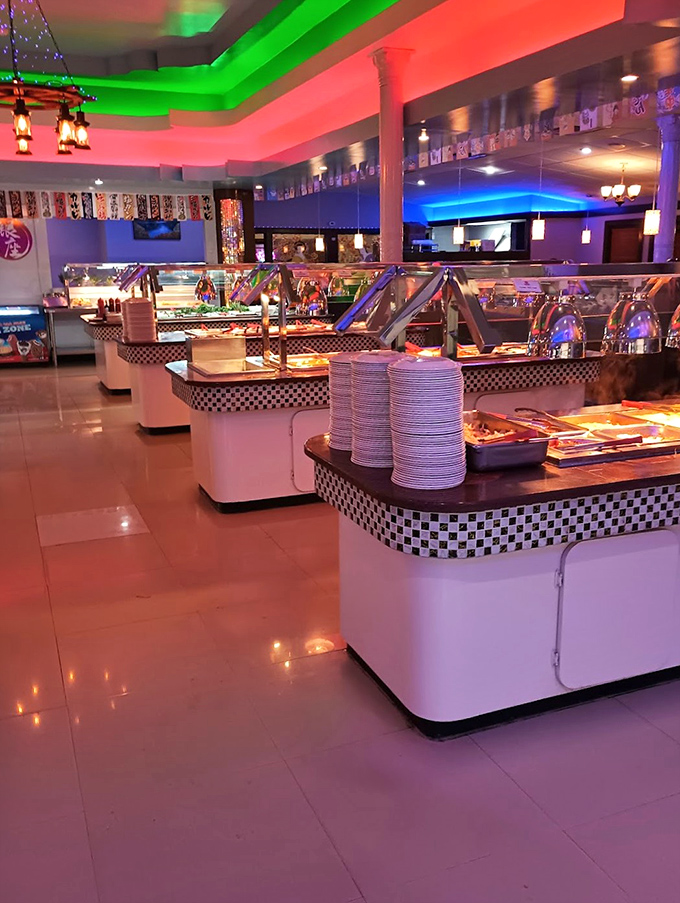 Neon lighting transforms this buffet into a food-focused nightclub. The plates are the VIPs, and everyone's on the guest list.