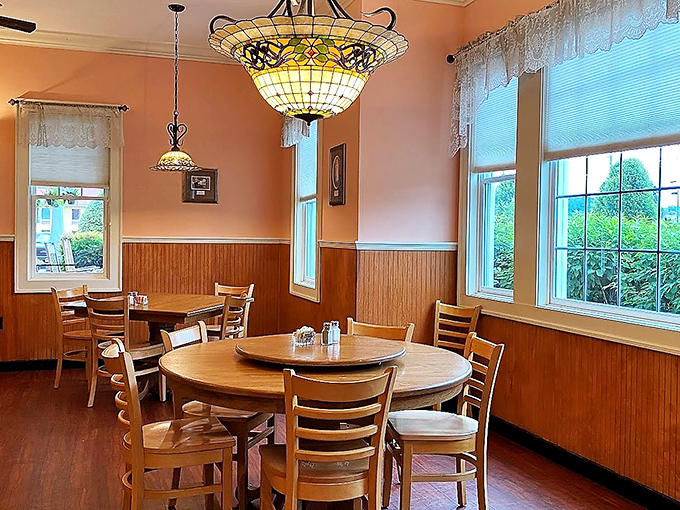 Tiffany-style lamps cast a warm glow over wooden tables where countless "just one more biscuit" negotiations have taken place.