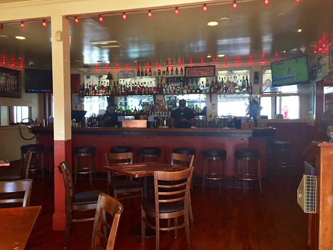 Inside, the warm wooden bar area glows with string lights, creating that perfect balance of "dive bar charm meets waterfront gem" that's increasingly rare in today's world.