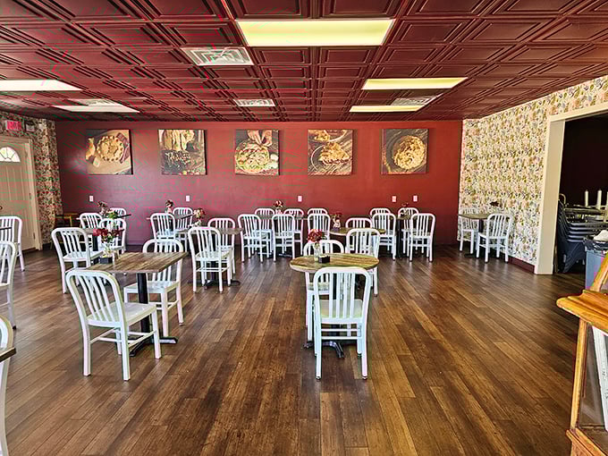 Burgundy walls adorned with pie portraits create a shrine to flaky perfection. The white chairs aren't just furniture&mdash;they're front-row seats to one of Missouri's greatest culinary performances.