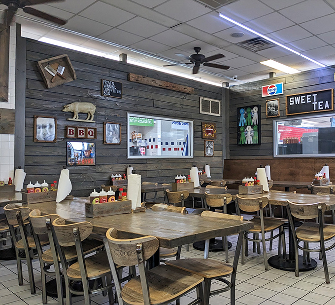 Rustic wood paneling, simple tables, and pig motifs create the perfect backdrop for serious eating. No distractions from the main event: championship-level barbecue.