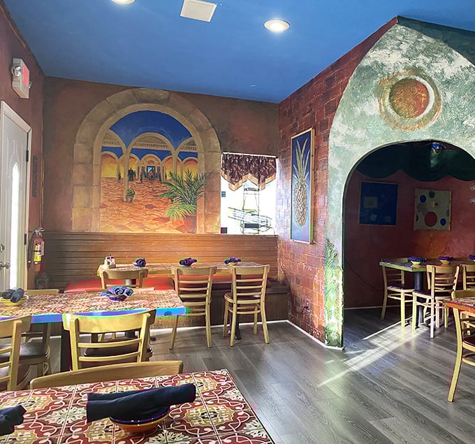 Step inside and the terracotta walls whisper stories of Mexican villages while that sky-blue ceiling makes you forget you're in Florida, not Frida Kahlo's courtyard.