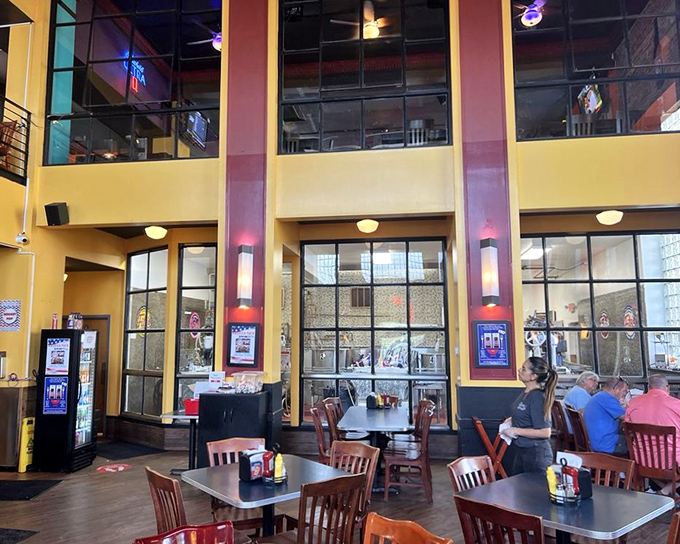 The two-story interior combines industrial chic with nostalgic charm, where exposed brick and soaring ceilings create the perfect backdrop for carbonated adventures.