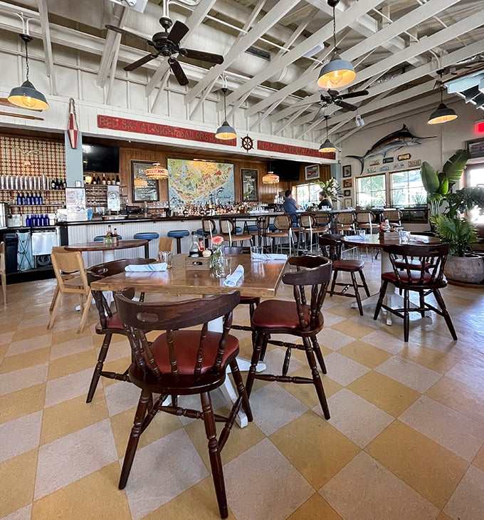 Nautical nostalgia meets modern comfort inside Sullivan's, where checkerboard floors, wooden chairs, and white-beamed ceilings create the perfect backdrop for seafood indulgence.