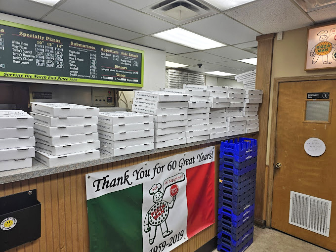 Pizza boxes stacked high like a carbohydrate skyscraper &ndash; a beautiful sight that signals you're about to experience something truly special.