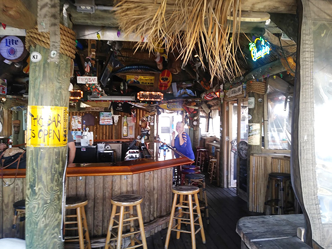 Step inside and time slows down. The weathered wood, dangling memorabilia, and that "YES OPEN" sign tell you to leave your worries at the door.