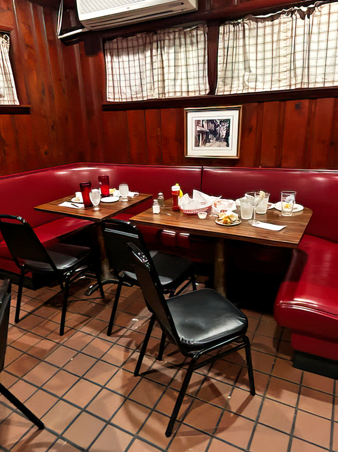 Red vinyl booths and warm wood paneling create that perfect "everybody knows your name" atmosphere where memories are made between bites of legendary sandwiches.