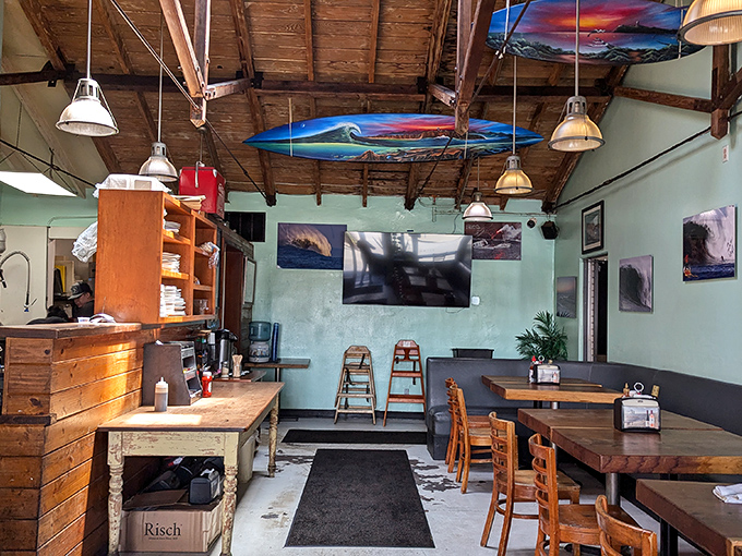 Surfboards suspended from wooden rafters tell you everything: this isn't some corporate chain pretending to have coastal charm—this is the real, salty deal.