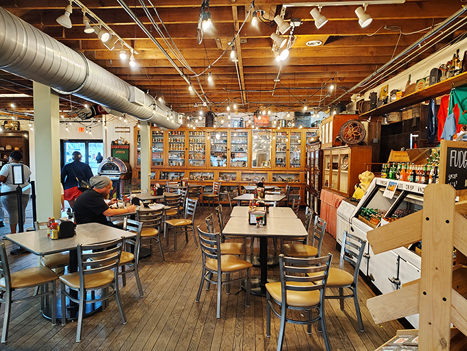 Inside, the dining area blends seamlessly with the country store, creating that rare atmosphere where shopping and eating become one delightful treasure hunt.