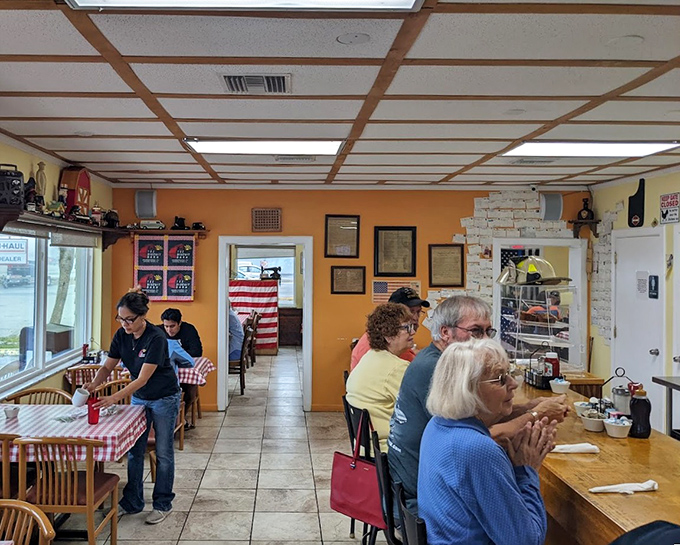 Inside, orange walls and American flags create that perfect "grandma's kitchen meets local diner" vibe where calories don't count and coffee refills are mandatory.