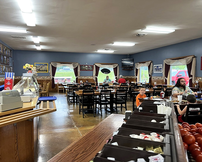 Inside, blue walls and country curtains create the perfect backdrop for family gatherings where conversations flow as freely as the coffee.