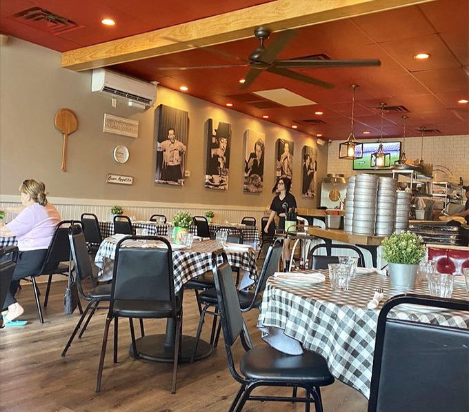 Classic black-and-white checkered tablecloths meet sports memorabilia on the walls—a dining room that feels like Sunday at your favorite aunt's house, if she could really cook.