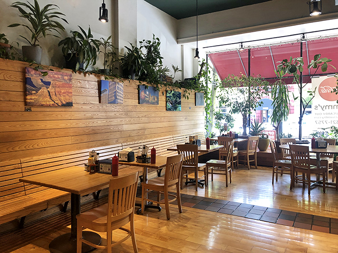 Wooden warmth meets botanical bliss in Tommy's airy dining room. Those plants aren't just decoration&mdash;they're practically roommates in this sunlit sanctuary.