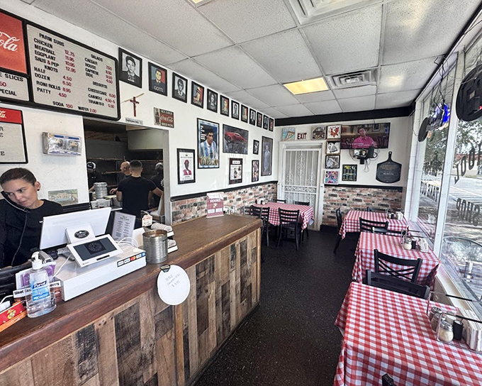 Inside, red-checkered tablecloths and memorabilia-lined walls create that perfect "I've just discovered somewhere special" feeling that makes neighborhood pizzerias magical.