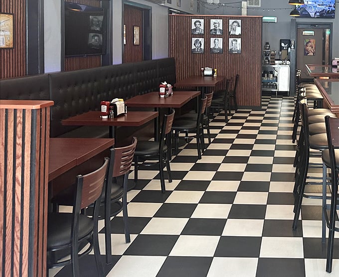 Classic black and white checkered floors meet wood-paneled walls, creating that perfect time-capsule atmosphere where calories don't count and conversations flow freely.