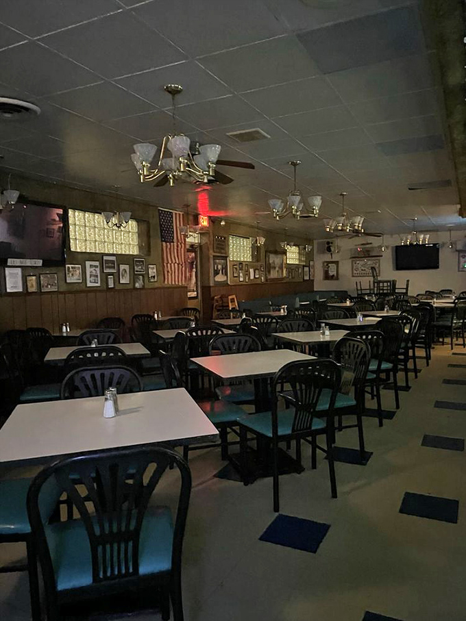 Time stands still inside these walls where wood paneling, ceiling fans, and decades of memories create the perfect pizza atmosphere.