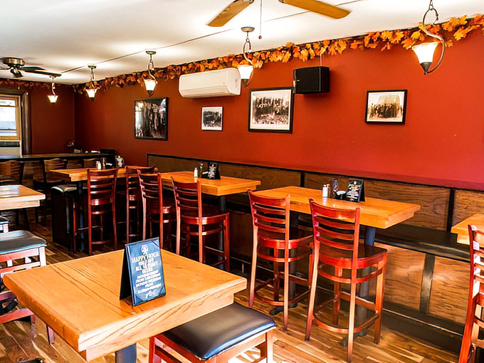 Warm red walls and wooden accents create that perfect "where everybody knows your name" vibe, minus Norm and Cliff arguing at the bar.