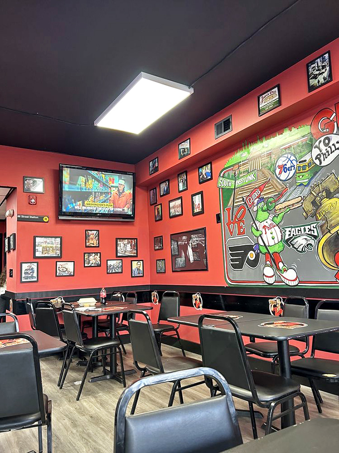 Those red walls and sports murals create the perfect backdrop for your cheesesteak pilgrimage &ndash; pure Philadelphia pride on display.