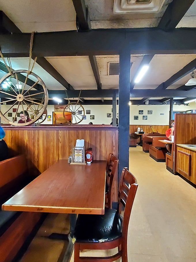 Wagon wheels and wood paneling set the stage for barbecue drama. This isn't interior design; it's a time machine to when calories didn't count.