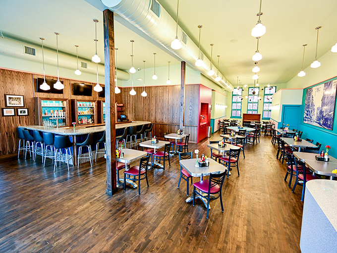 Retro charm meets modern comfort in this thoughtfully preserved dining room. The wood paneling and pendant lights create the perfect backdrop for breakfast epiphanies. 