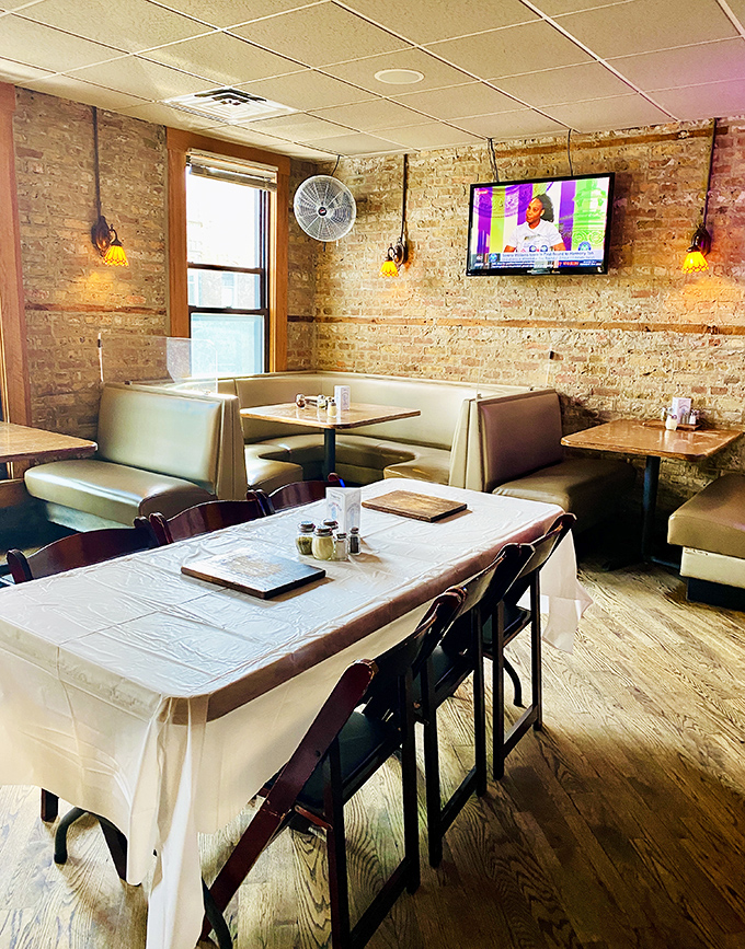 Exposed brick walls and cozy booths create that perfect "I've discovered something special" atmosphere where memories are made between bites.