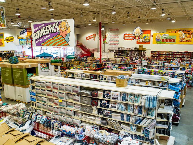Welcome to retail paradise! Ollie's vast interior features colorful department signs that guide shoppers through a wonderland of unexpected deals.