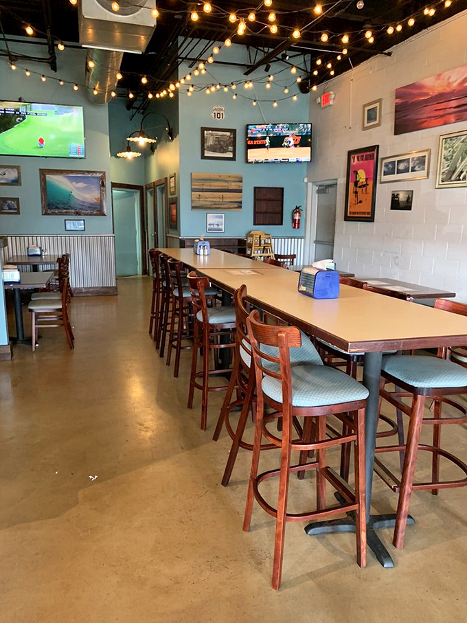 String lights dance overhead in this beachy-cool interior where turquoise walls and surf photography transport you straight to Baja without the passport.