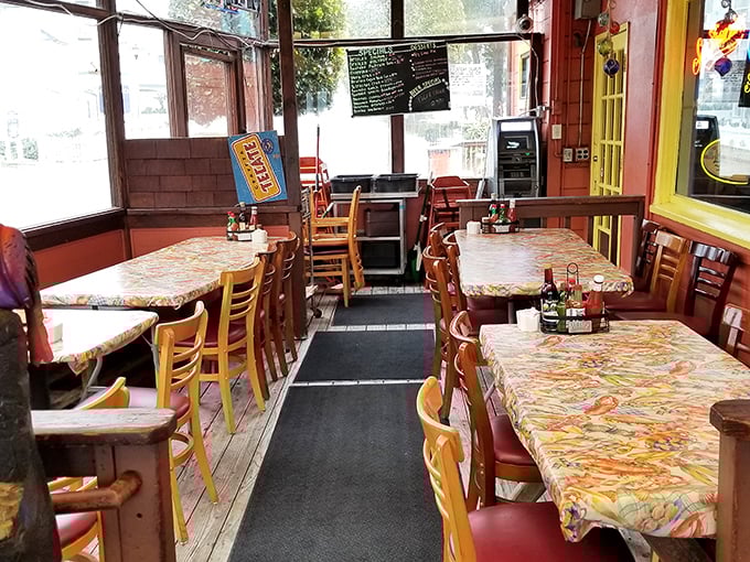 Inside Barbara's Fishtrap, colorful tablecloths and wooden chairs create that perfect "I've discovered something special" vibe that fancy restaurants spend millions trying to fake.