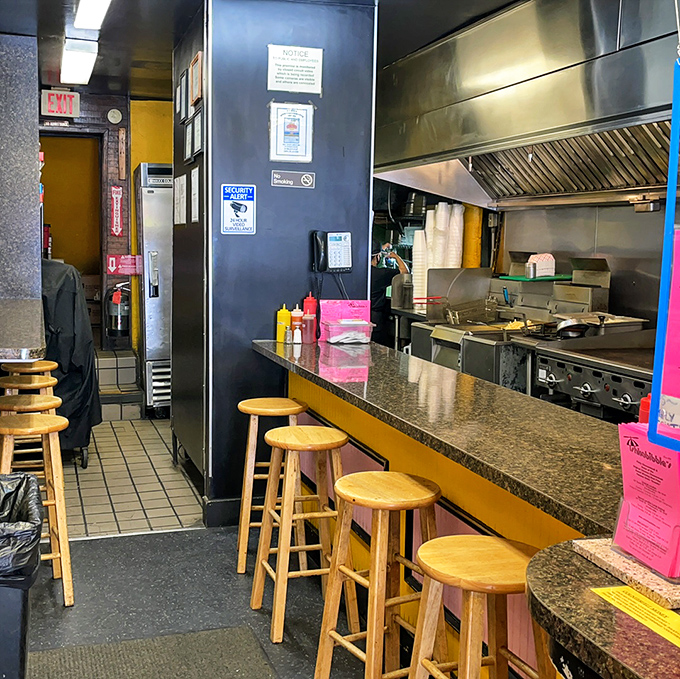 Inside, the narrow counter space offers front-row seats to culinary magic. Grab a stool and prepare for sandwich nirvana.