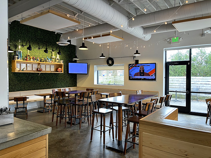 Modern meets comfort in this airy interior where exposed ductwork and greenery create the perfect backdrop for chicken-induced euphoria.