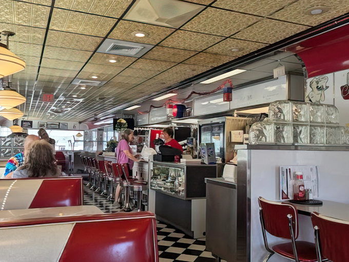 Red vinyl booths and a classic checkerboard floor set the stage for culinary nostalgia that tastes as good as your memories.
