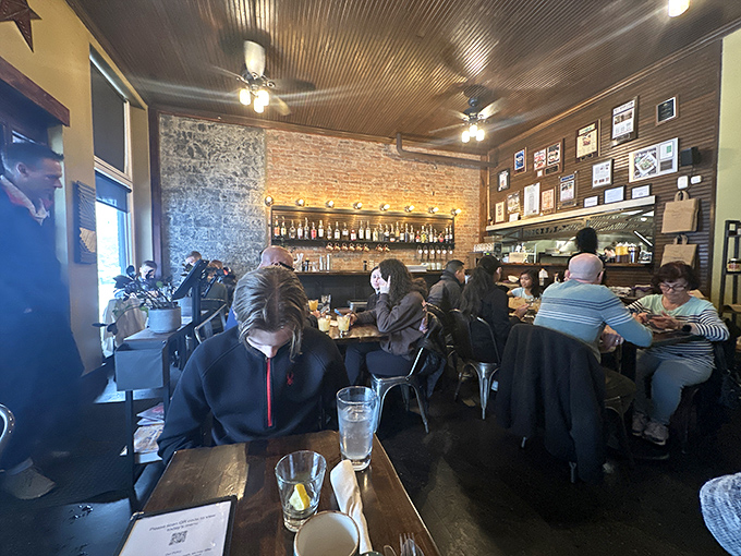 Where rustic meets urban - exposed brick, tin ceiling, and the buzz of happy diners create that rare atmosphere where memories are made between bites.