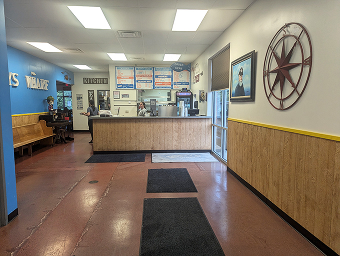 Nautical charm meets Midwestern practicality at the ordering counter, where that impressive compass rose reminds you good food is always worth navigating toward.