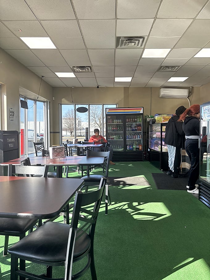 Simple tables, green carpet, and zero pretense &ndash; just the way great comfort food joints should be.